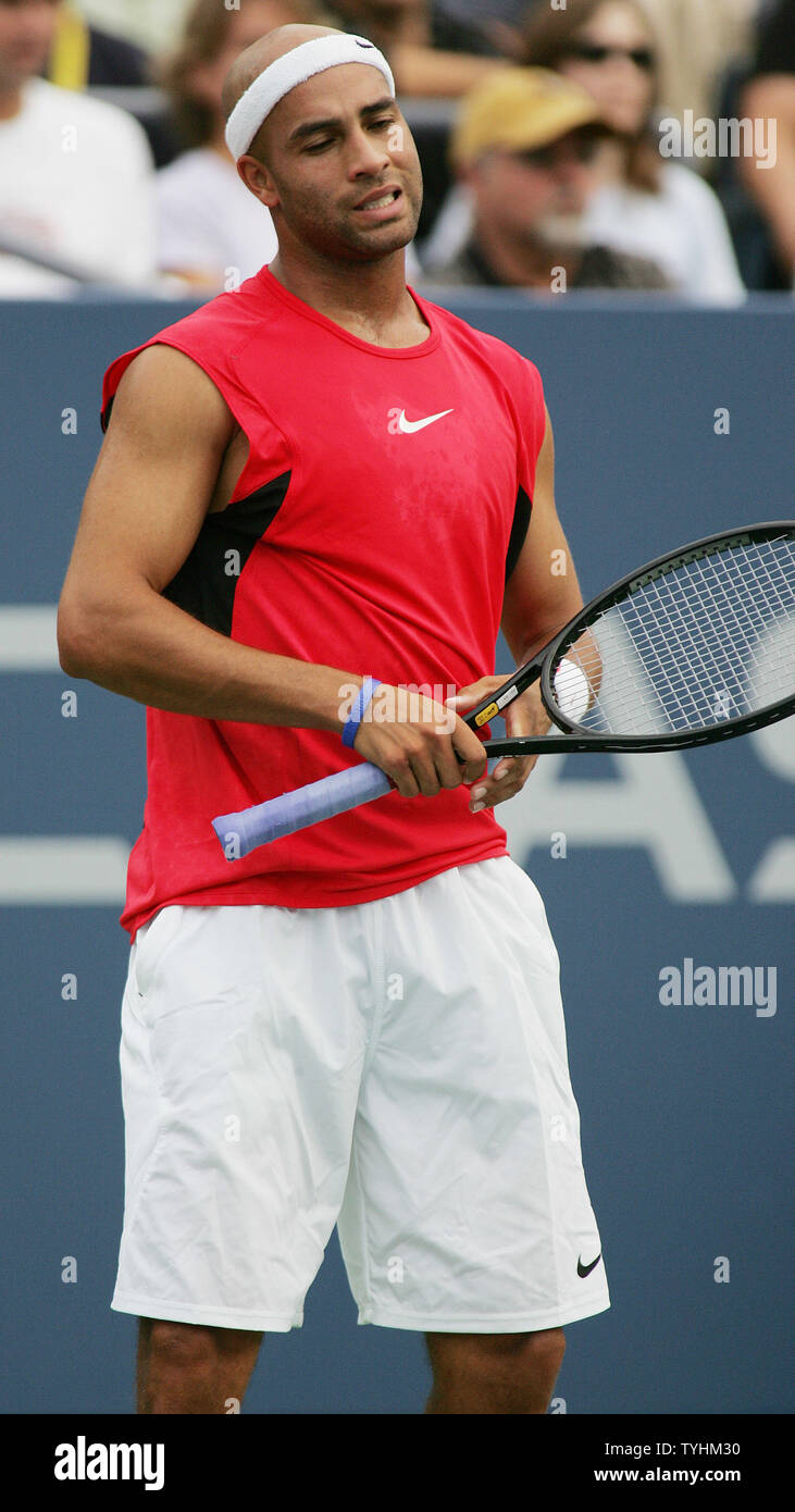 James Blake (USA), who is seeded fifth, reacts as he hits the ball foul ...