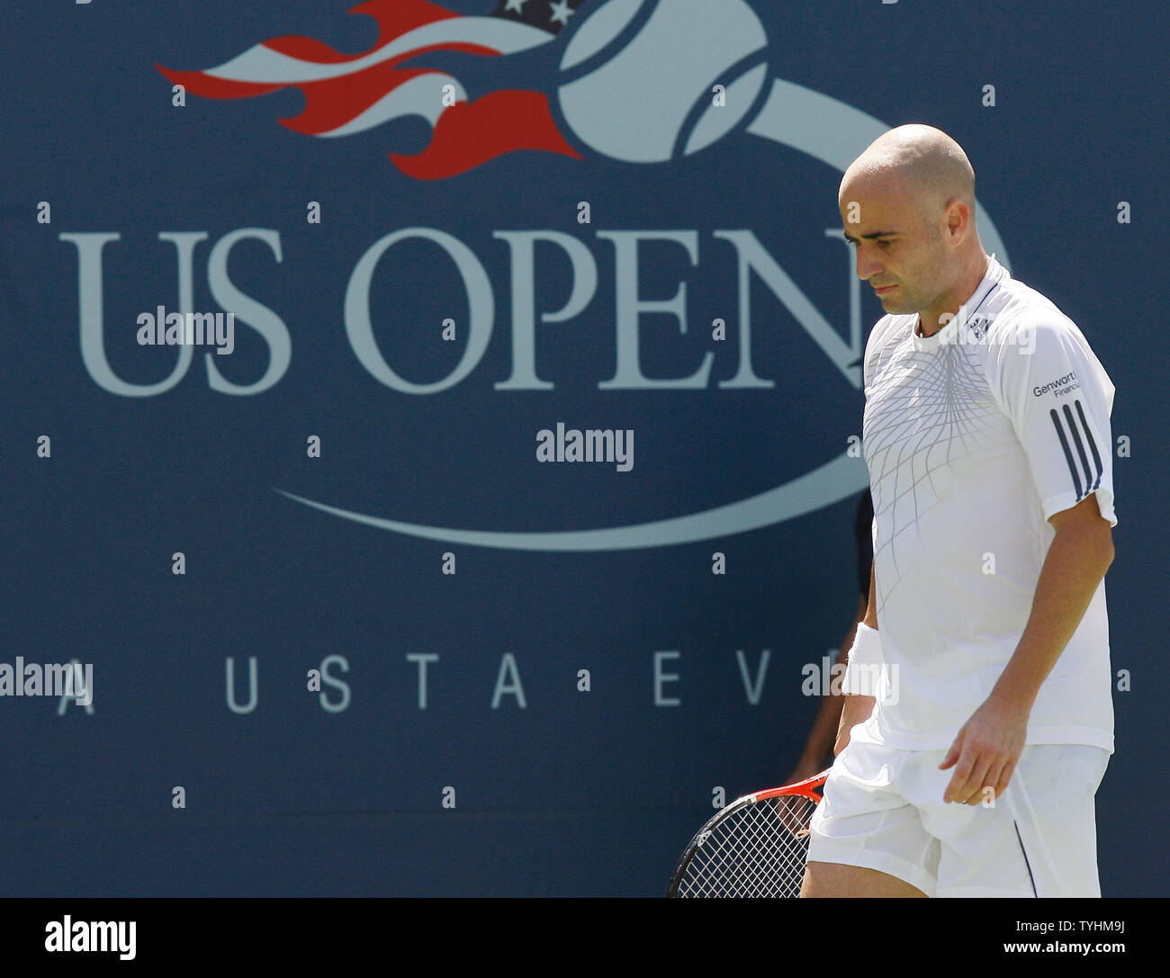 Andre Agassi walks cross court with his head down during the second set ...