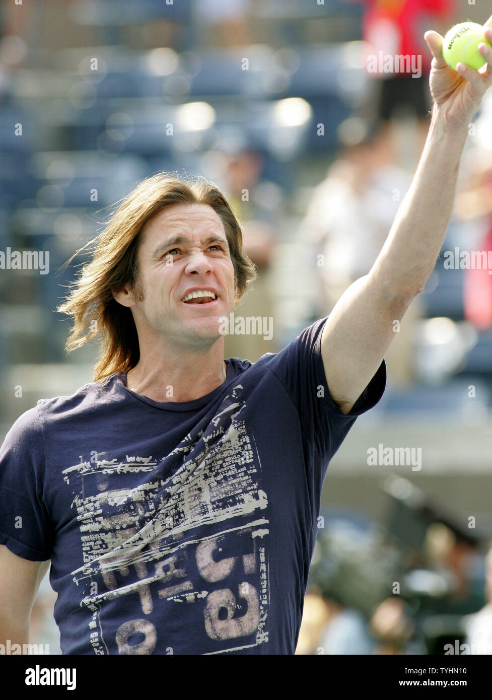 Actor and comedian Jim Carrey hit tennis balls into the stands as he ...