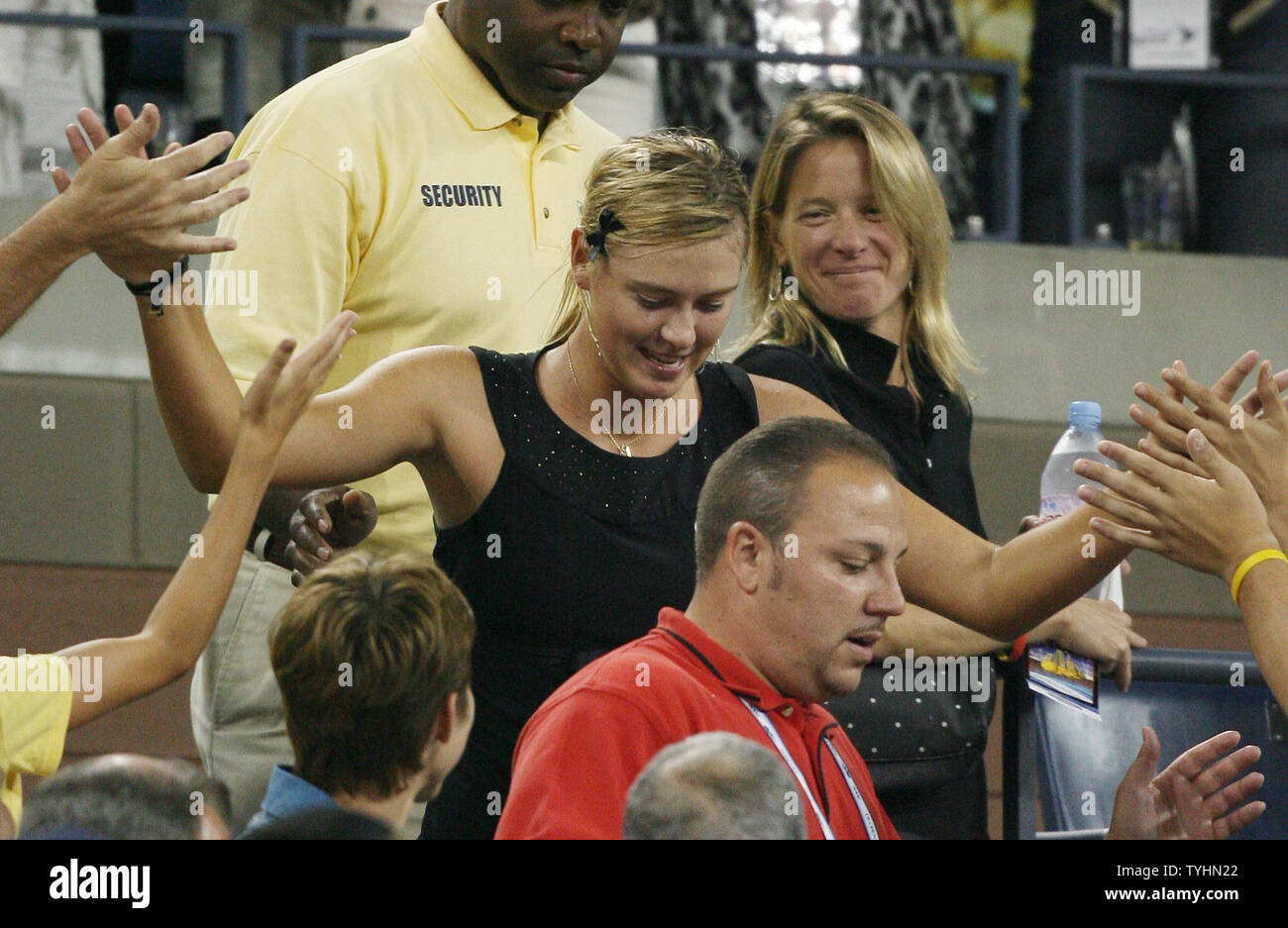 Maria Sharapova climbs up into the audience after match point during ...