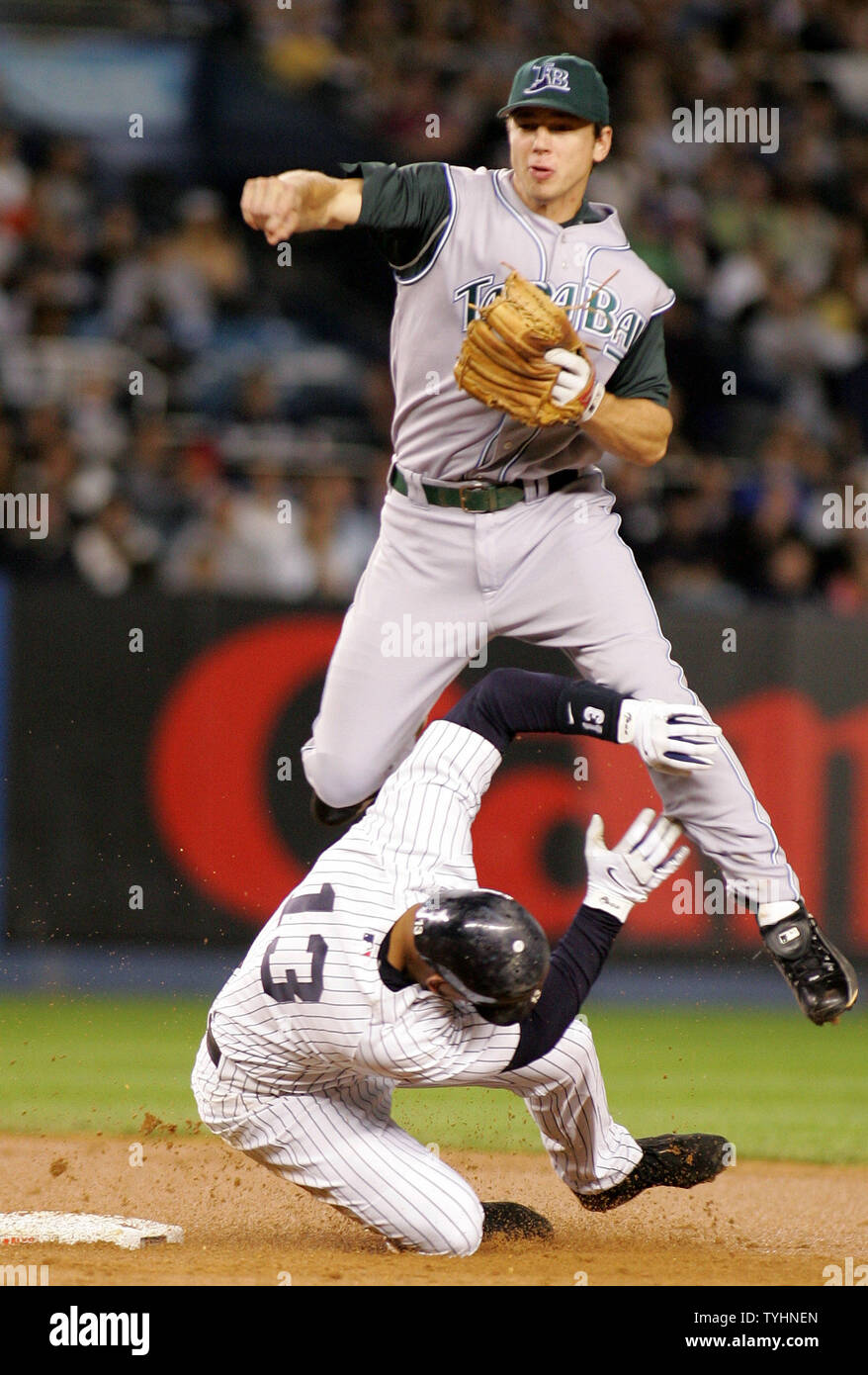 New York Yankees' Derek Jeter, bottom, tries to break up the play as ...