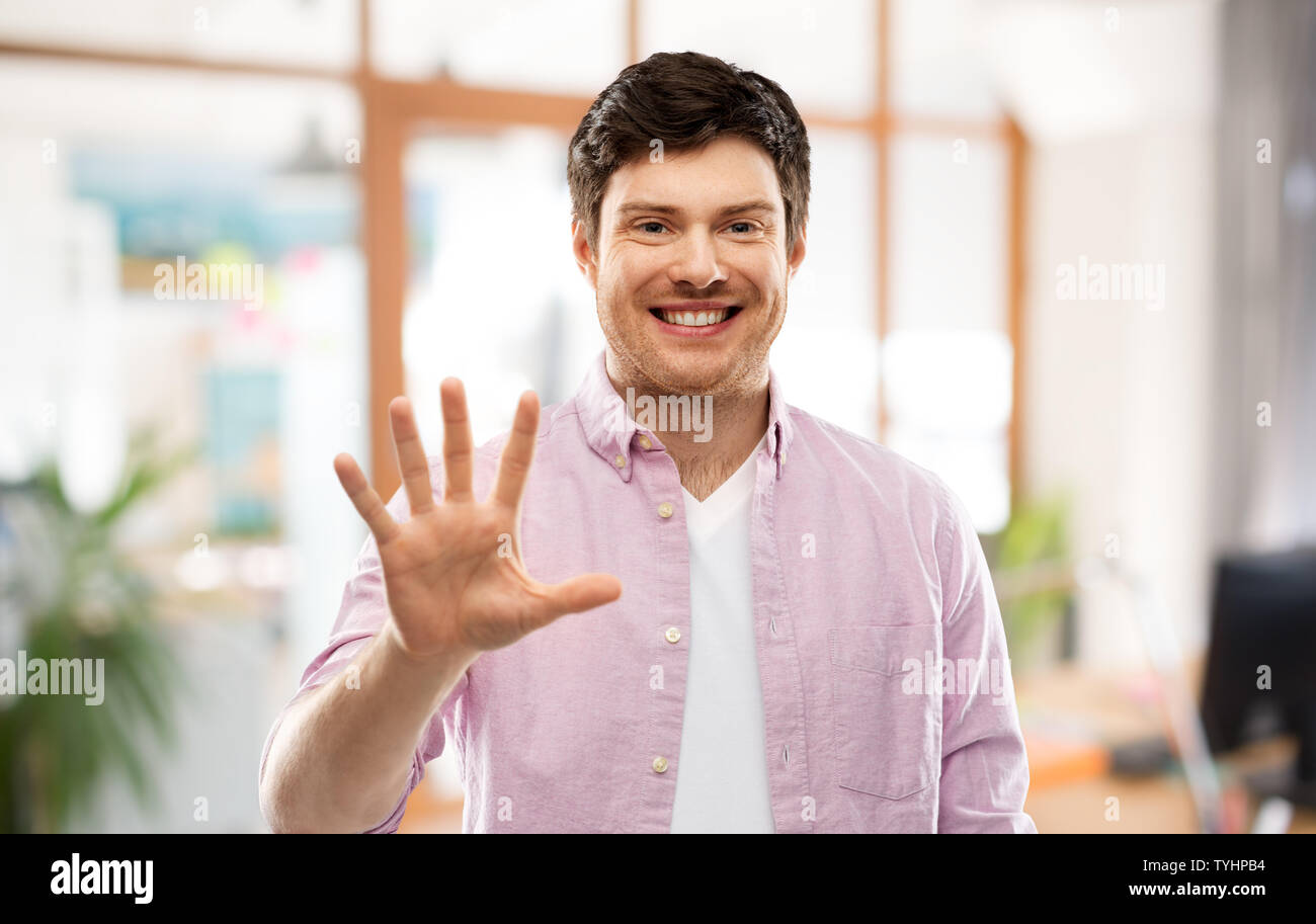 Guy showing five fingers hi-res stock photography and images - Alamy