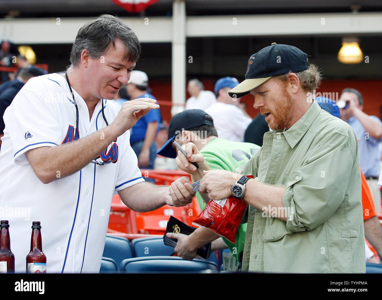Director Ron Howard signs Mets fan Rob Crossan's ticket stub at Shea ...