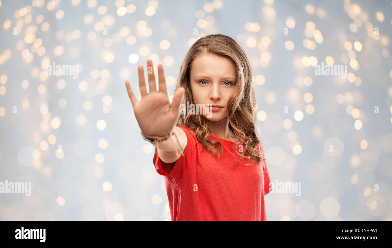 serious teenage girl showing stop gesture Stock Photo - Alamy