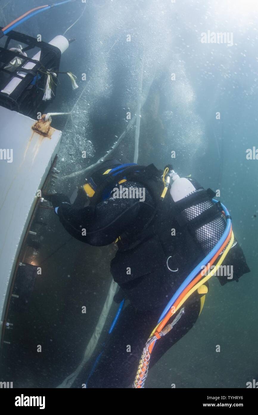 Petty Officer 1st Class Vincent Carson, assigned to Mobile Diving ...