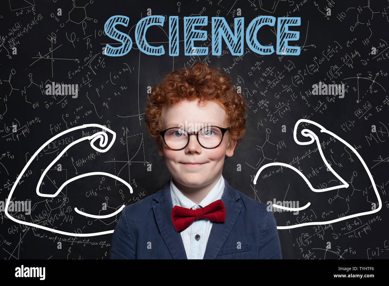 Learn Science. Strong smart child student on blackboard background with ...