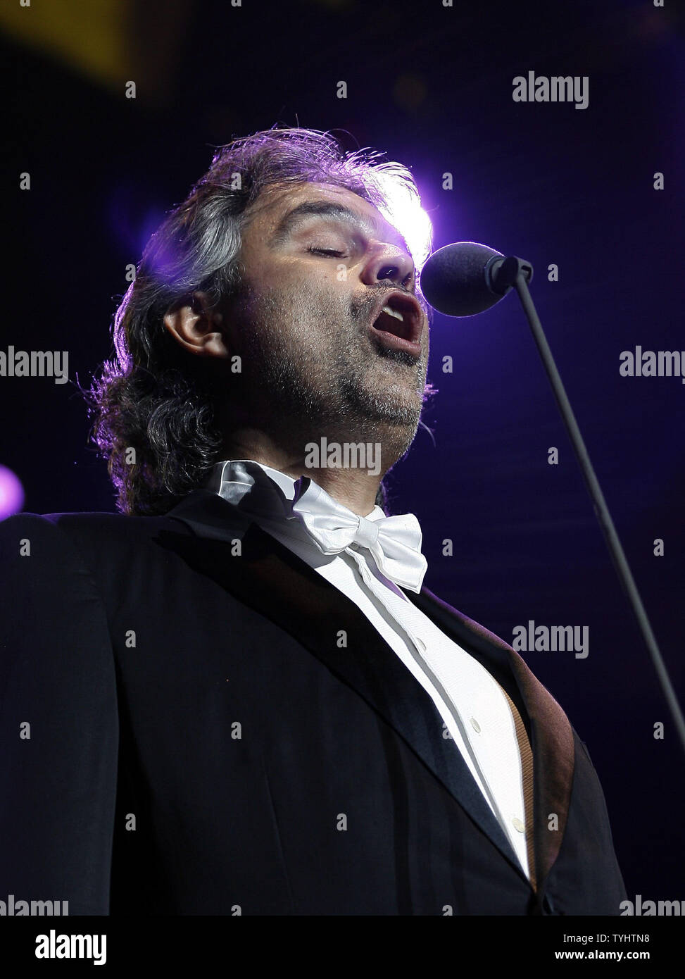 Andrea Bocelli sings into the microphone during his concert at Madison ...