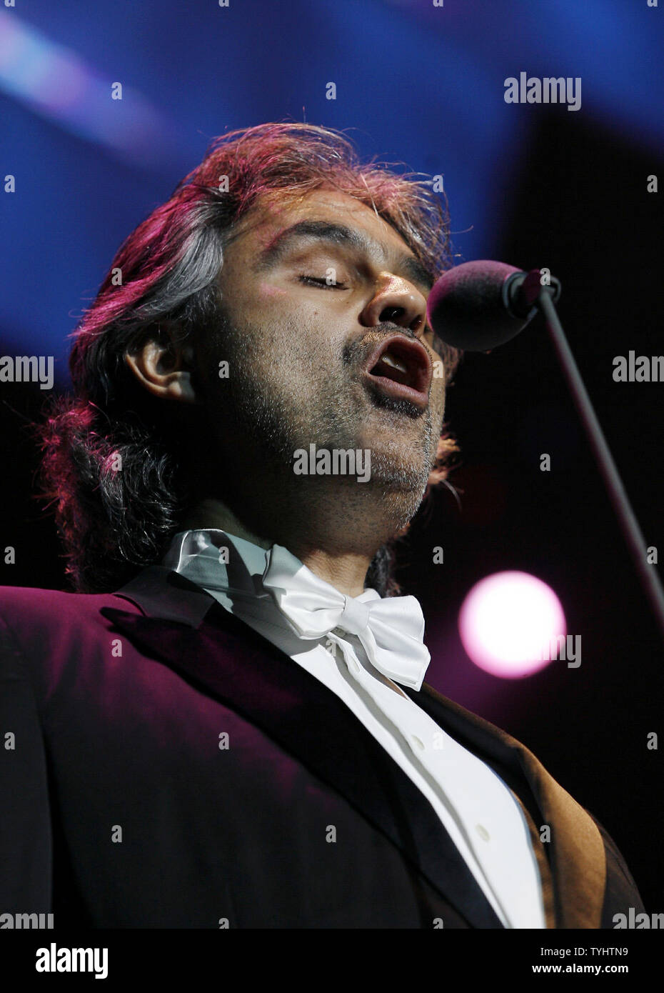 Andrea Bocelli sings into the microphone during his concert at Madison ...