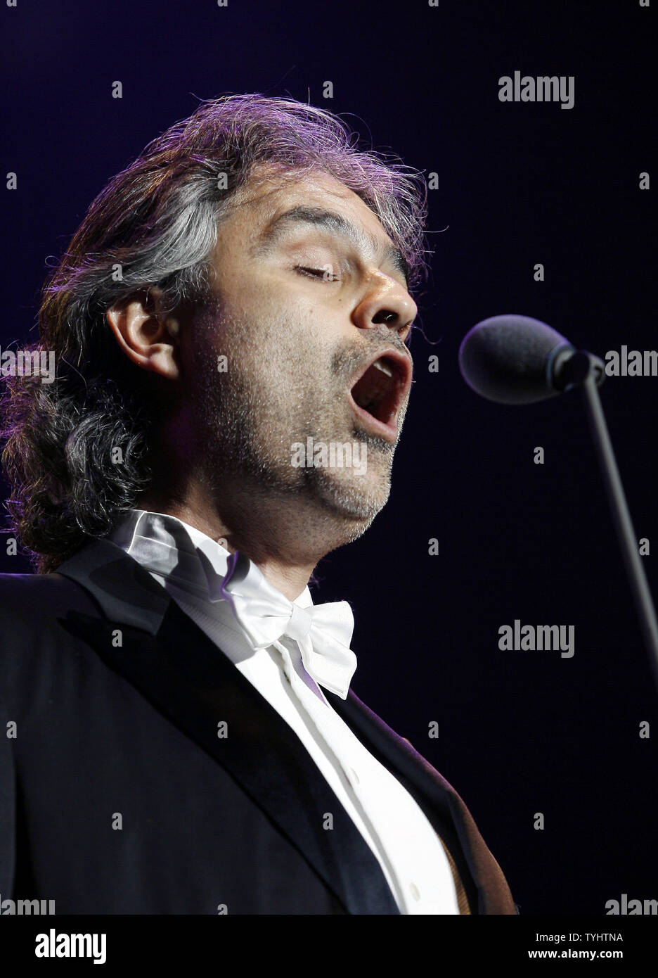 Andrea Bocelli sings into the microphone during his concert at Madison ...