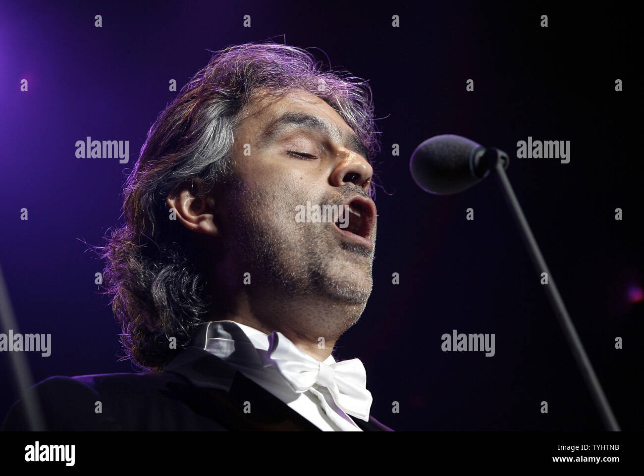 Andrea Bocelli sings into the microphone during his concert at Madison ...