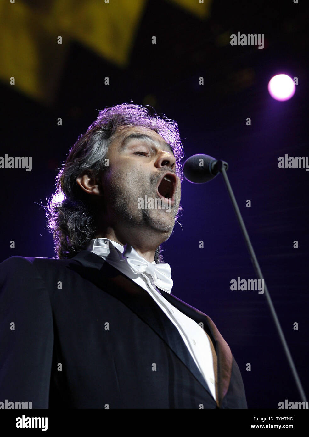 Andrea Bocelli sings into the microphone during his concert at Madison ...
