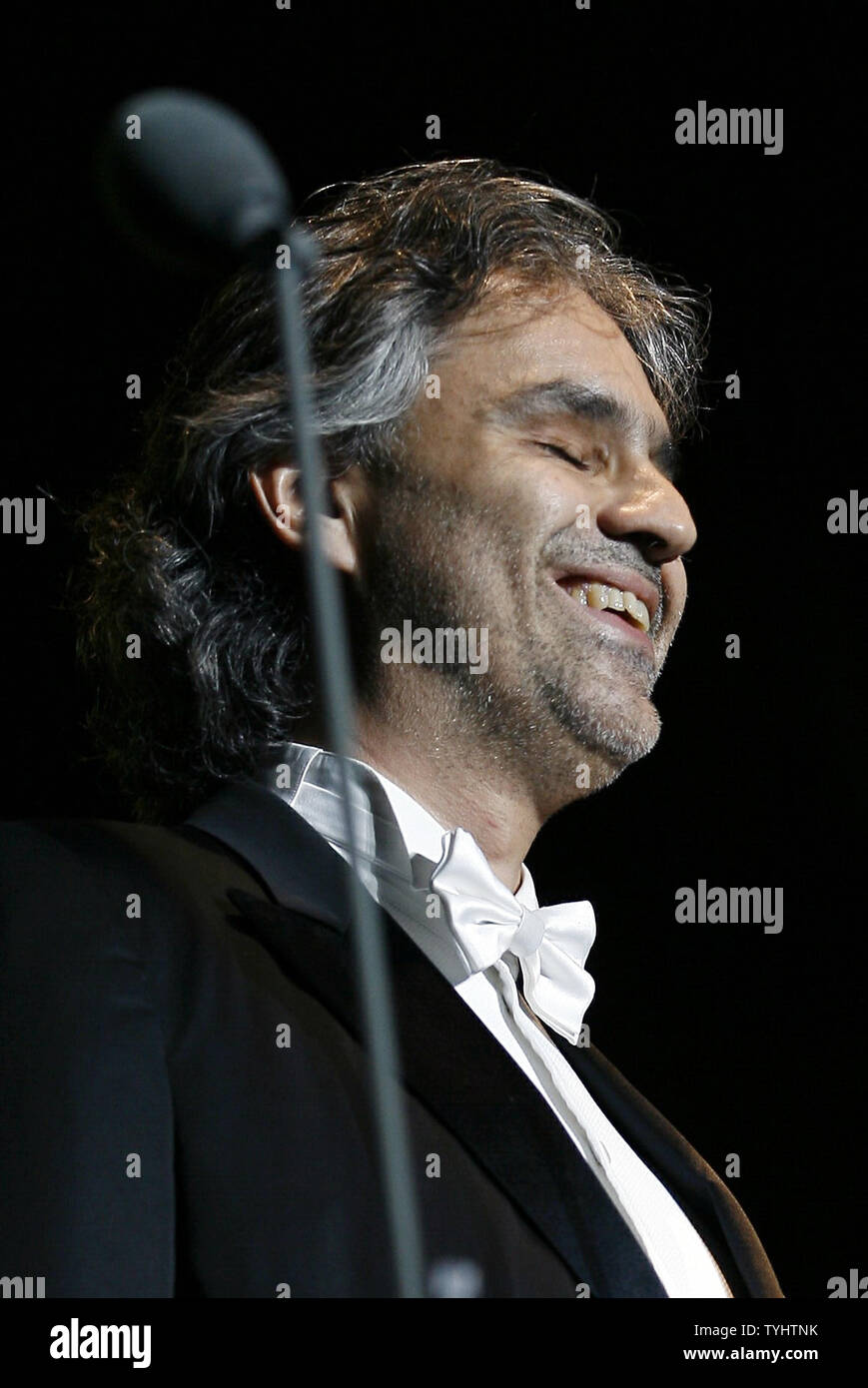 Andrea Bocelli sings into the microphone during his concert at Madison ...