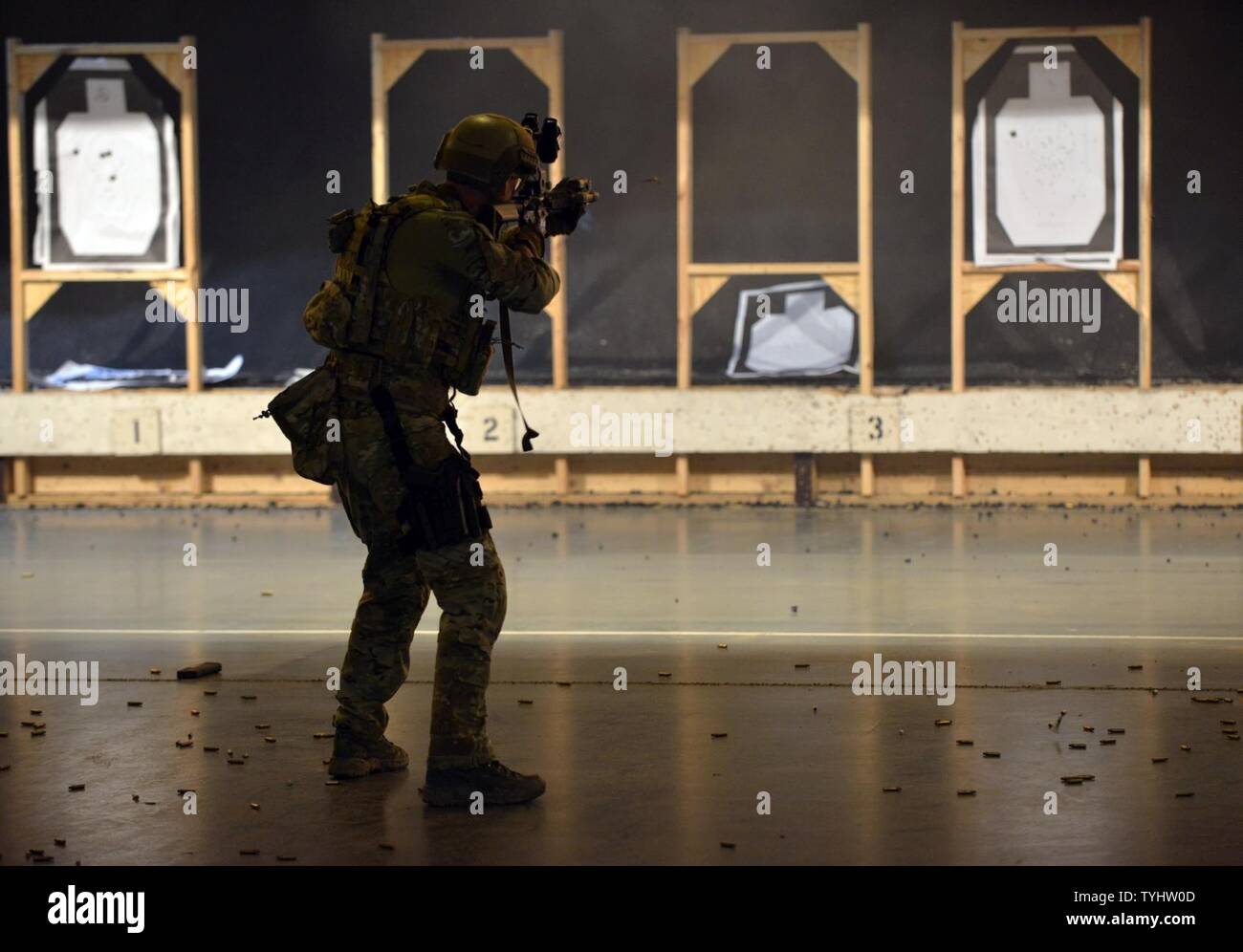 A U.S. Soldier assigned to 1-10th Special Forces Group fires at his ...