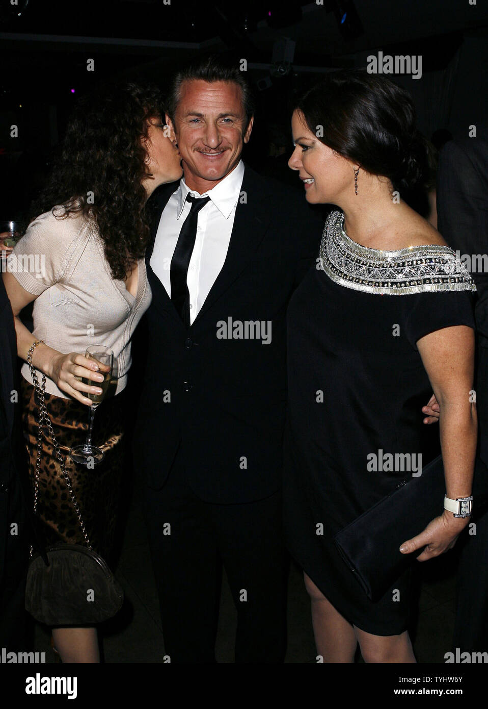 Daphna Kastner kisses Sean Penn while Marcia Gay Harden smiles at the ...