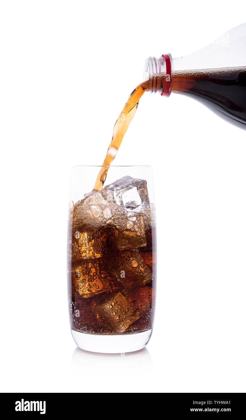 Bottle pouring Cola in drink glass with ice cubes Stock Photo - Alamy