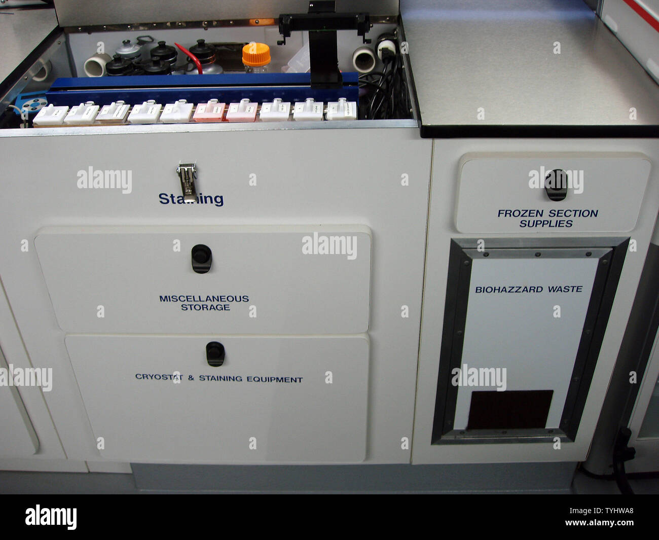 The photo shows the automatic slide stainer inside of the Doctors ...