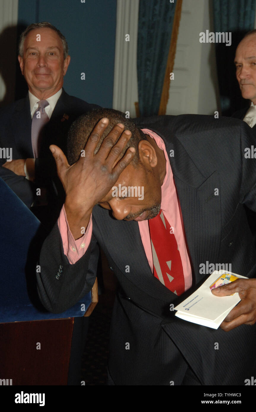 New York City Mayor Michael Bloomberg (left) listens to subway rescue ...