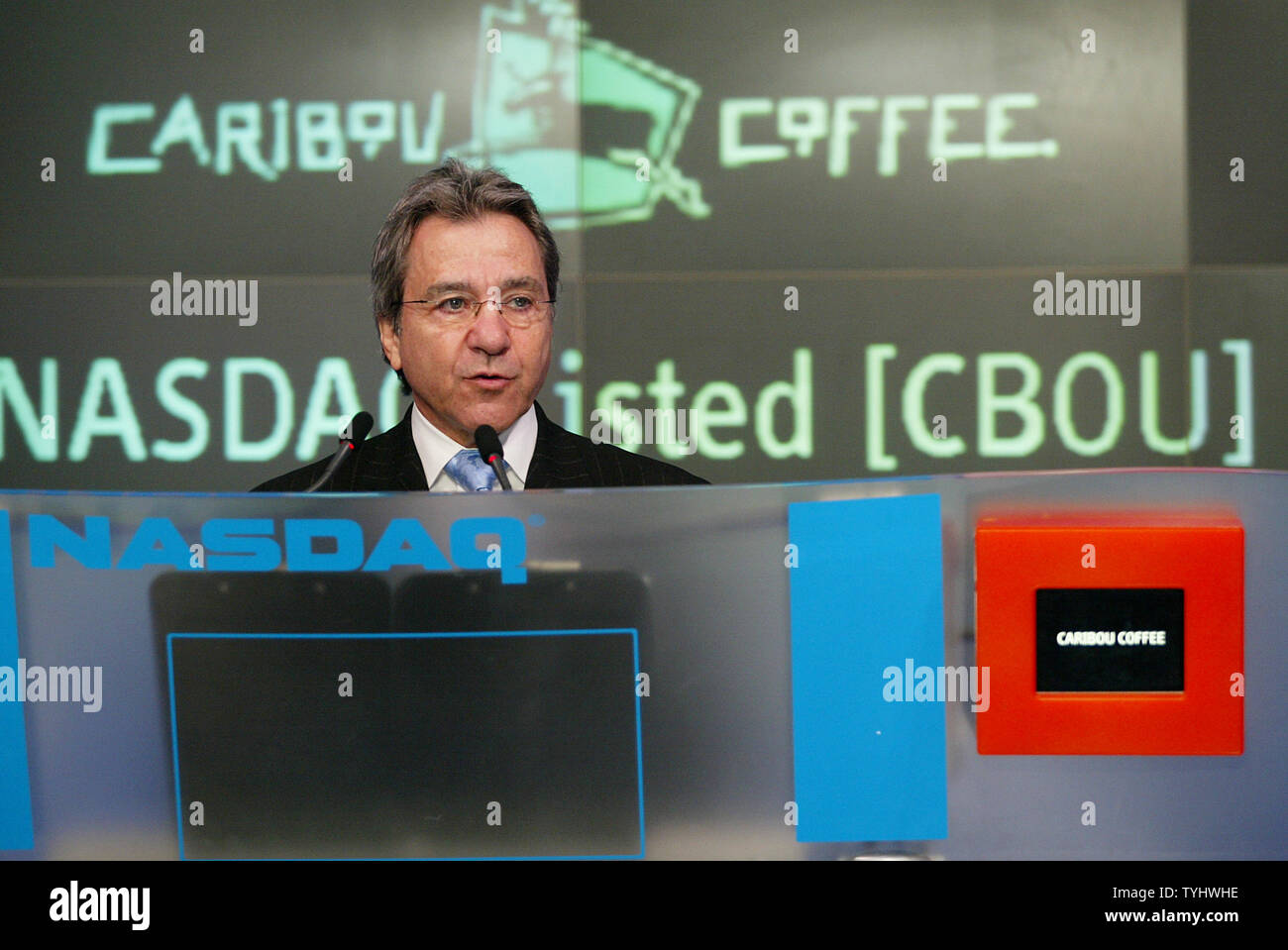 Michael Coles, CEO of Caribou Coffee, takes part in the opening bell ...