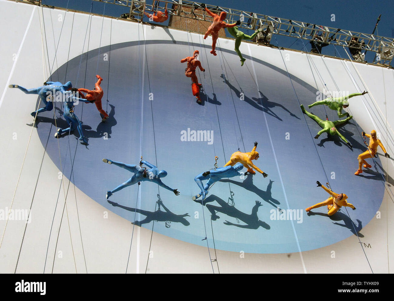 Aerial dancers perform on the side of the Terminal building in New York ...
