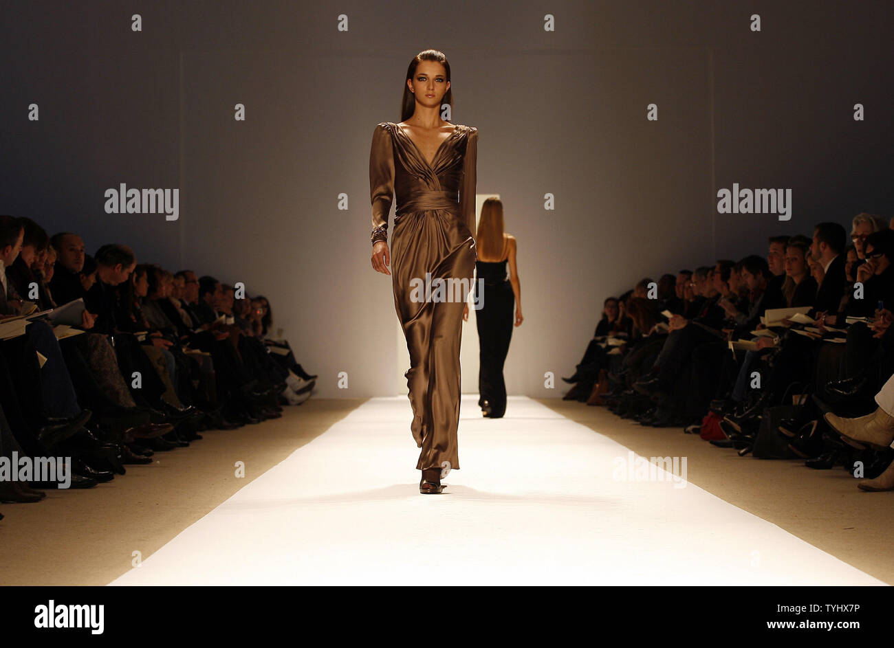 A fashion model walks down the runway at the Carlos Miele fashion show ...