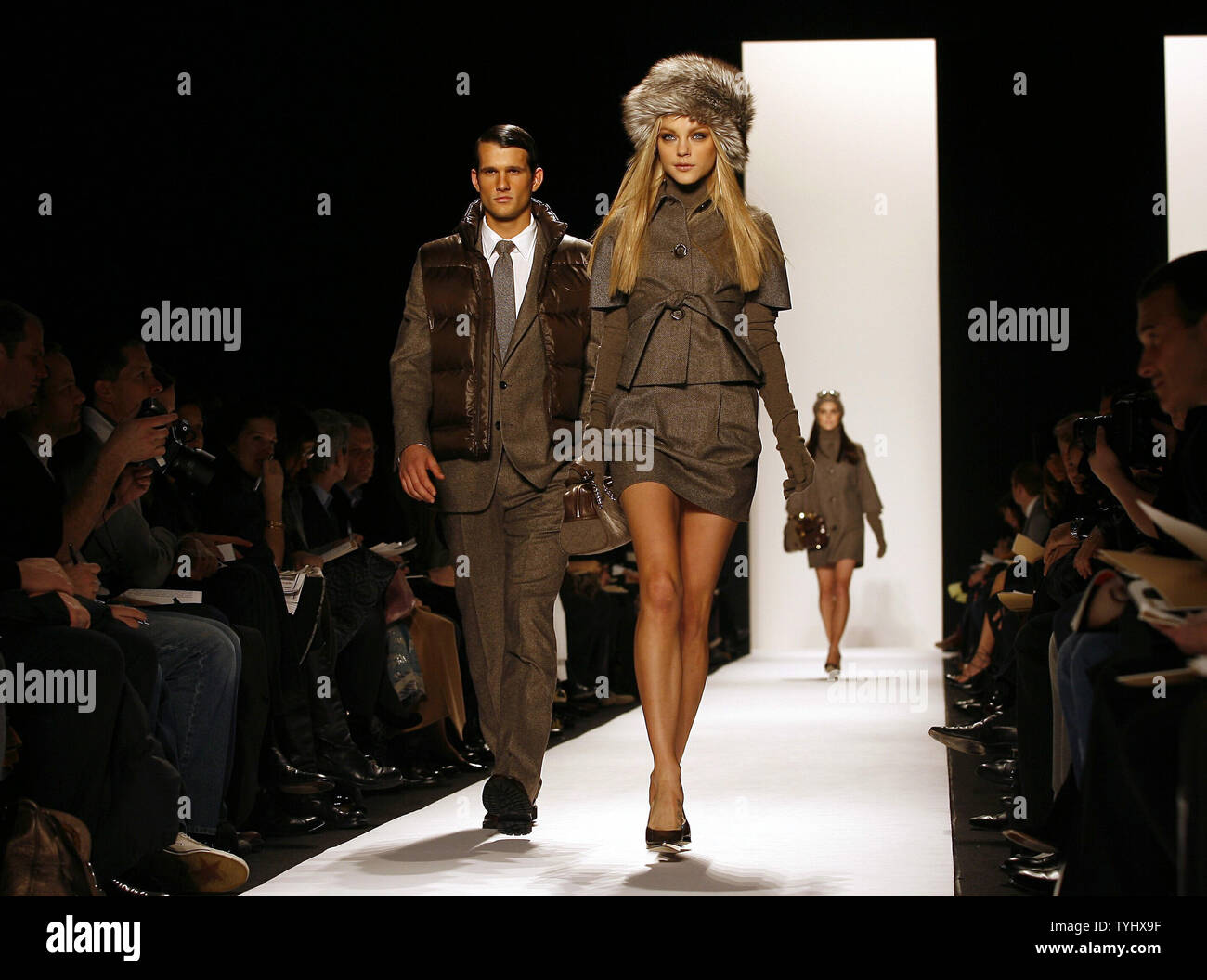 Models walk down the runway at the Michael Kors fashion show during ...