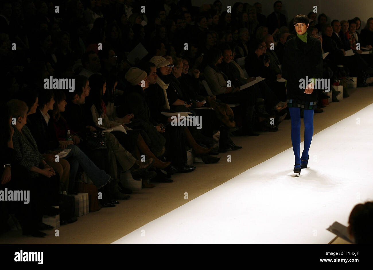 A fashion model walks down the runway at the Charles Nolan fashion show ...