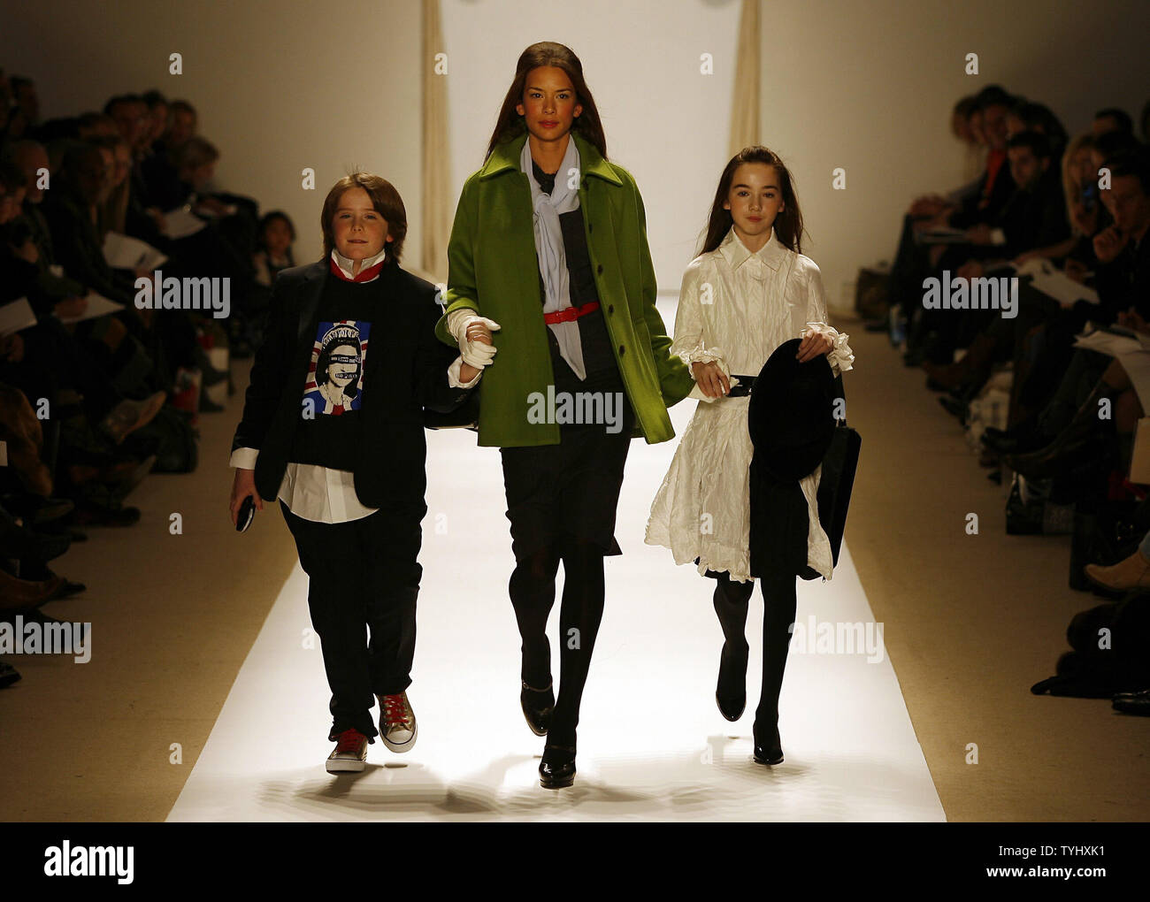 3 models walk down the runway at the Charles Nolan fashion show during ...