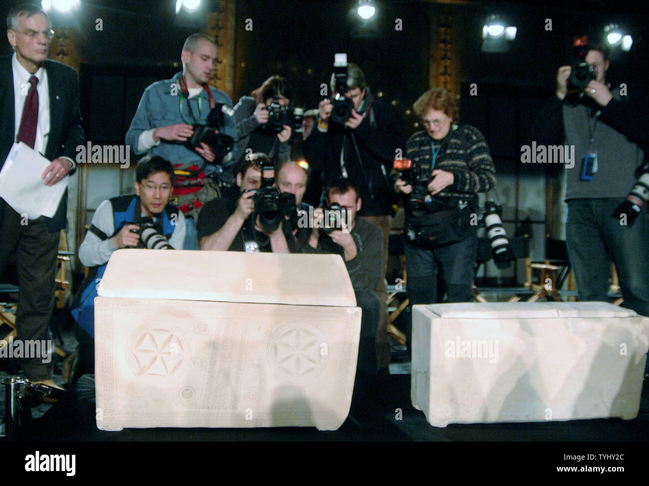 Members of the New York media surround two ossuary (bone boxes) that ...