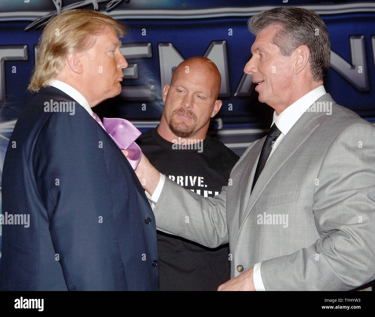 Wrestler/referee Stone Cold Steve Austin (C) looks on while World ...