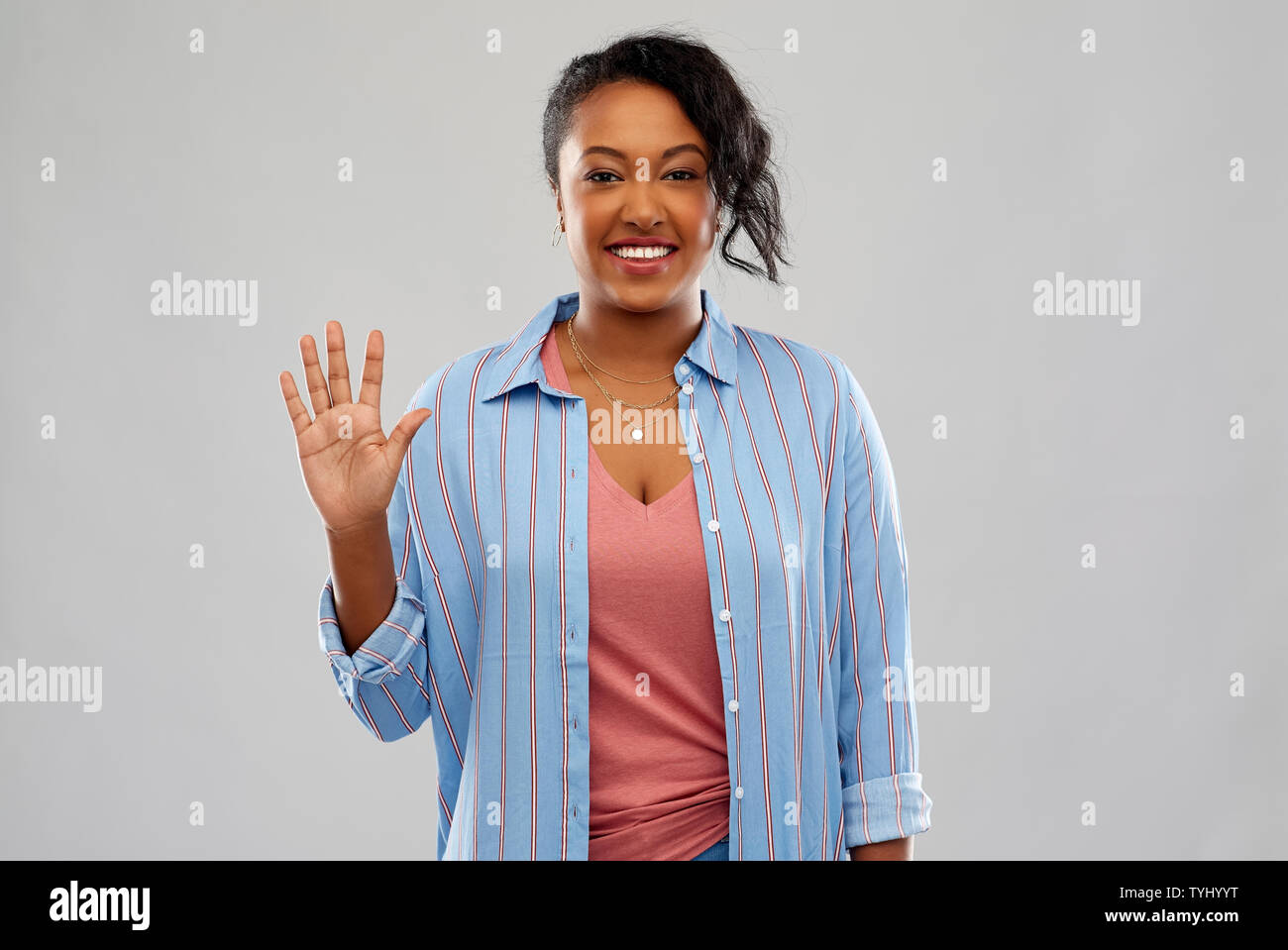 Woman waving hi-res stock photography and images - Alamy