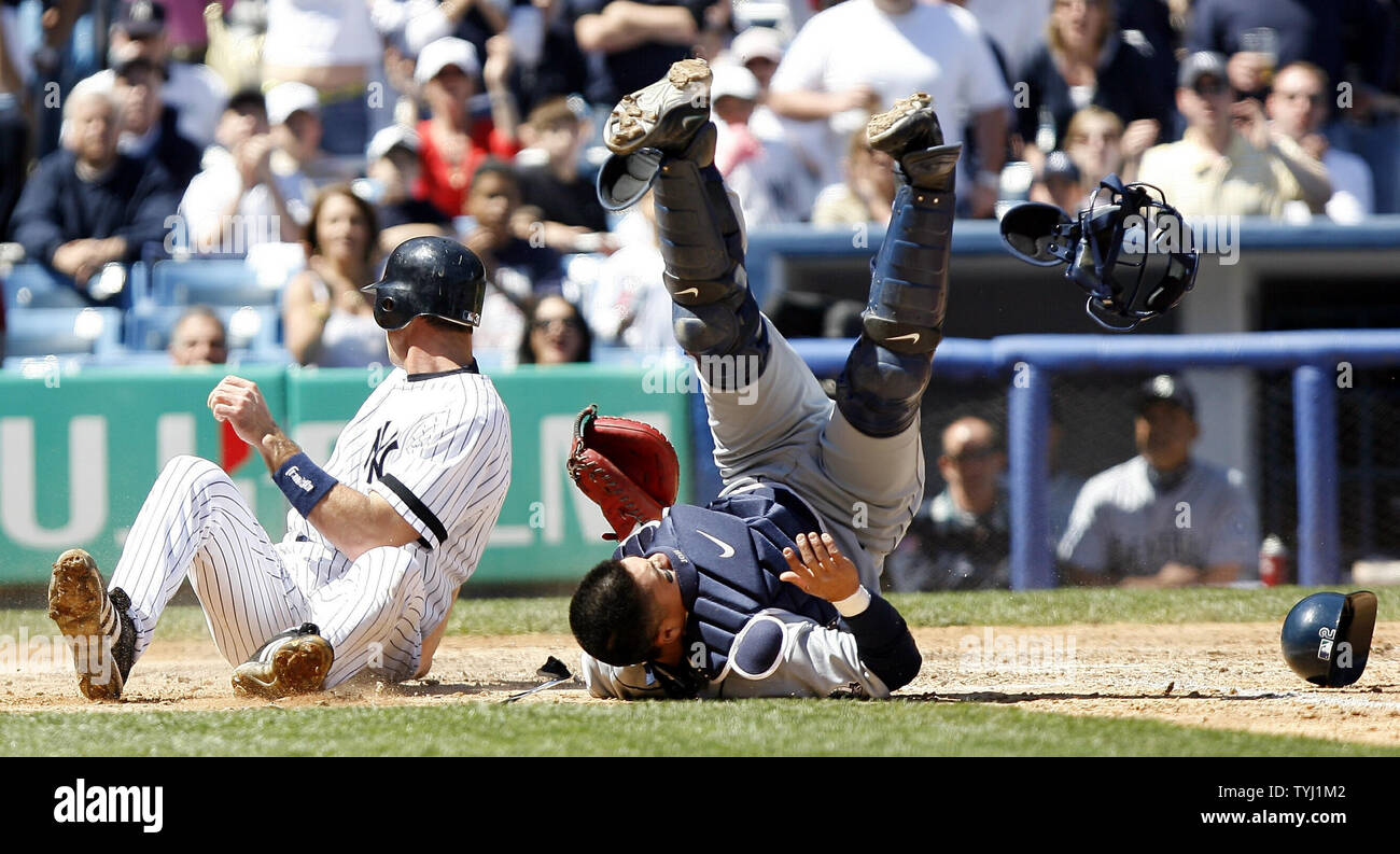 New York Yankees Josh Phelps slams into Seattle Mariners Kenji Johjima ...