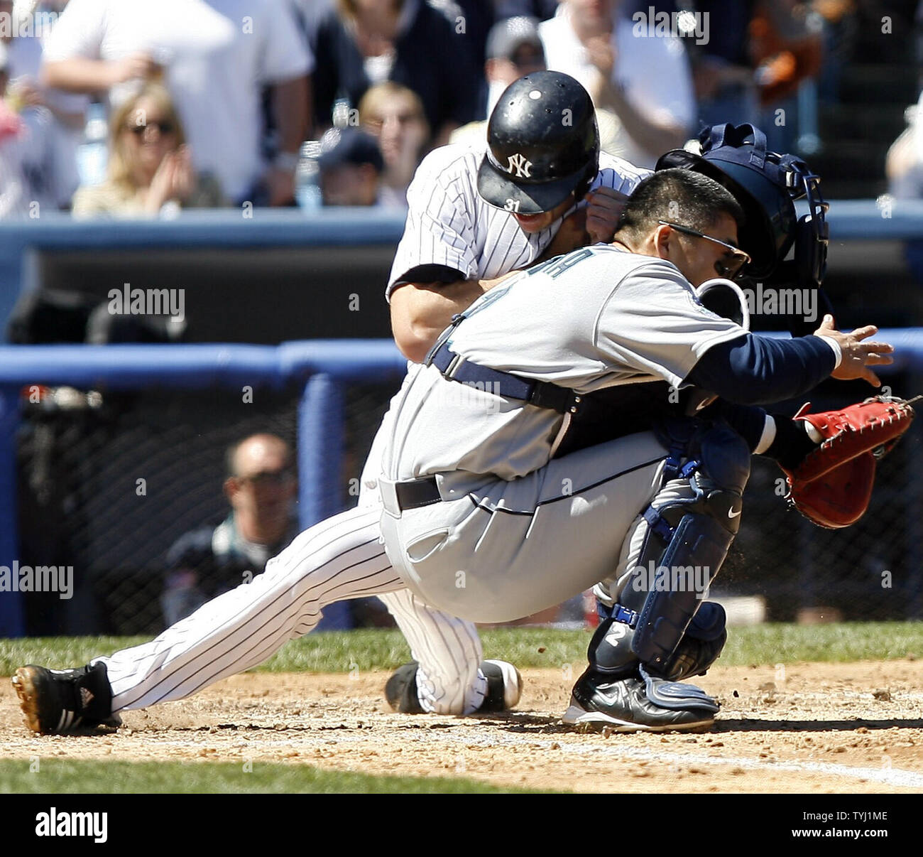 New York Yankees Josh Phelps slams into Seattle Mariners Kenji Johjima ...