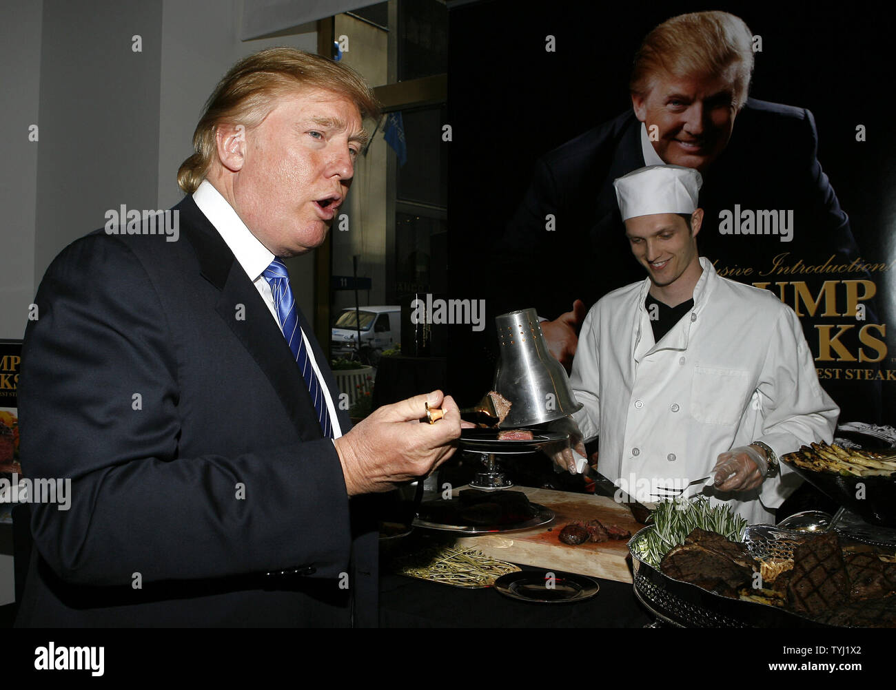 Donald Trump raises a fork filled with steak while celebrating the ...