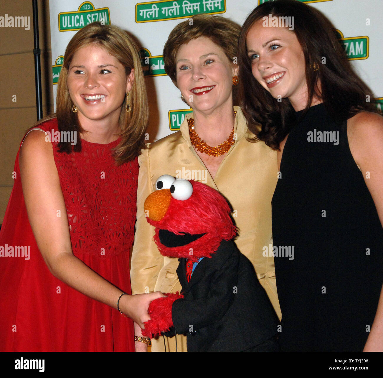 First Lady Laura Bush (C) and her daughters Jenna (L) and Barbara are ...