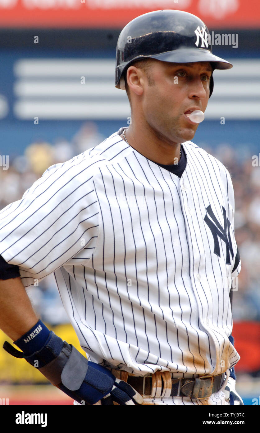 New York Yankees short stop Derek Jeter relaxes on base while the ...