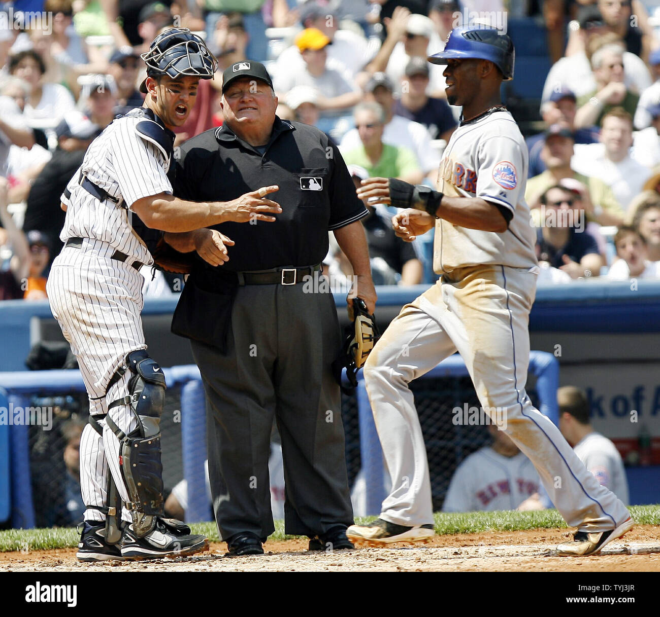 New York Yankees catcher Jorge Posada (L) argues with the home plate ...