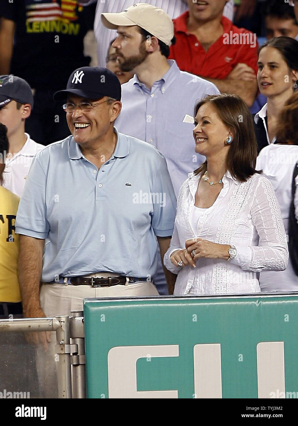 Rudi Giuliani and wife Judith Nathan stand up and smile in the 7th ...