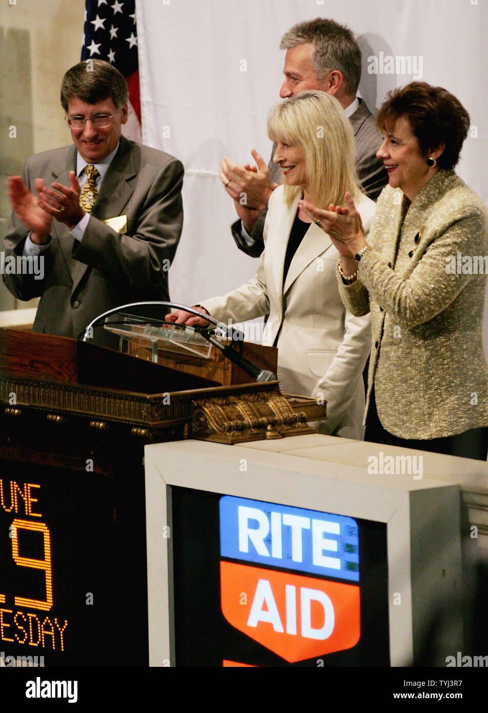 Rite Aid's President, CEO and Chair Mary Sammons (2nd R) rings the ...