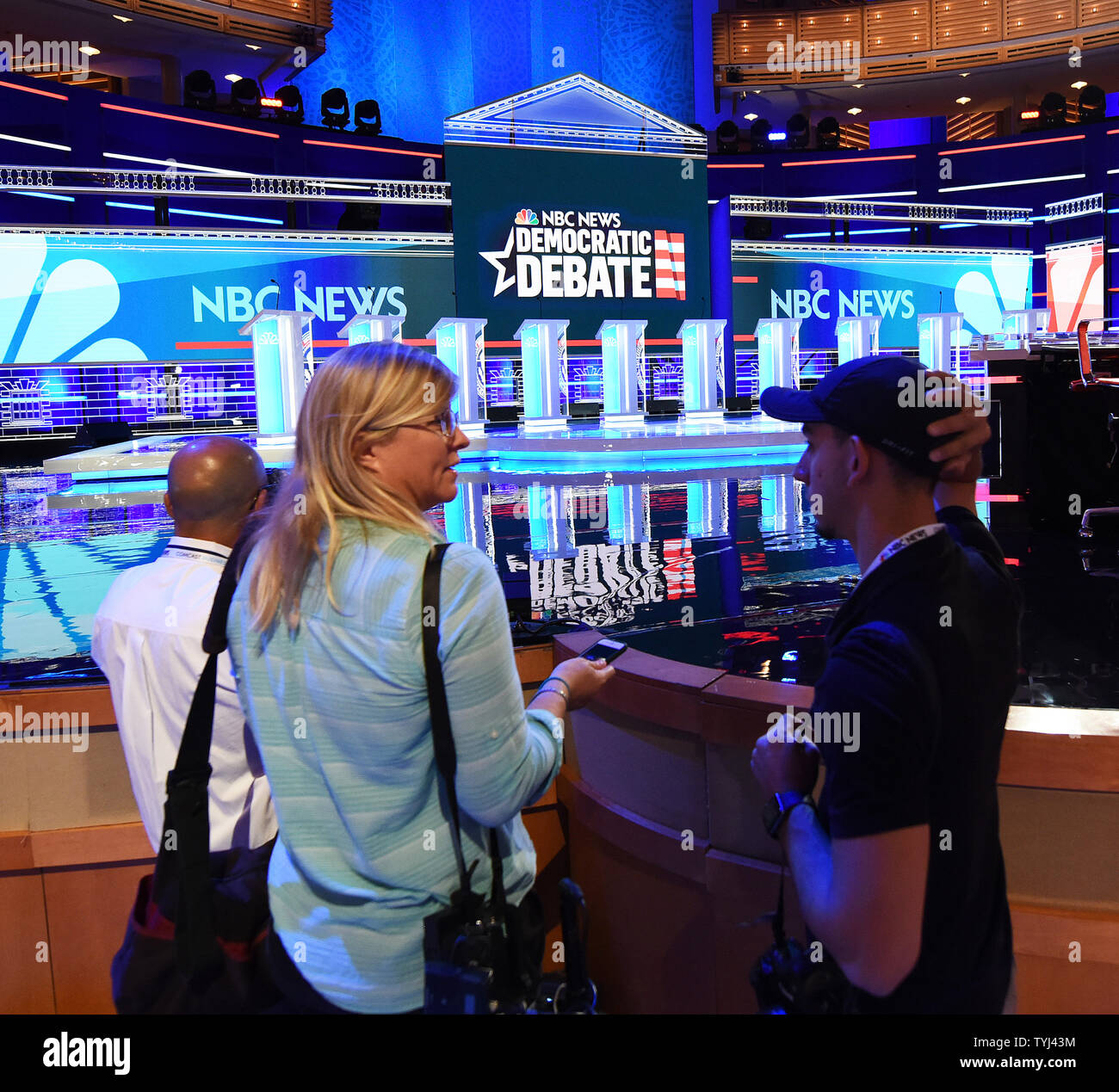 Miami, Florida, USA. 26th Jun 2019. Members of the media do a ...