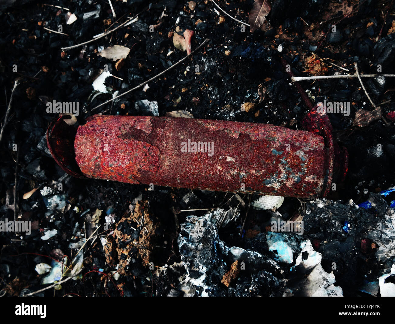 Burned and corroded insecticidal cans Stock Photo - Alamy