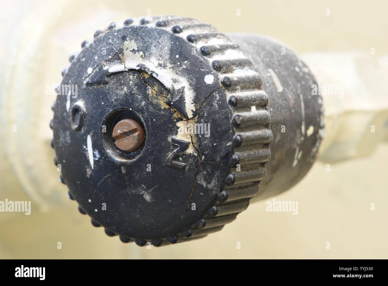 Old radiator valve close-up, heat control Stock Photo - Alamy