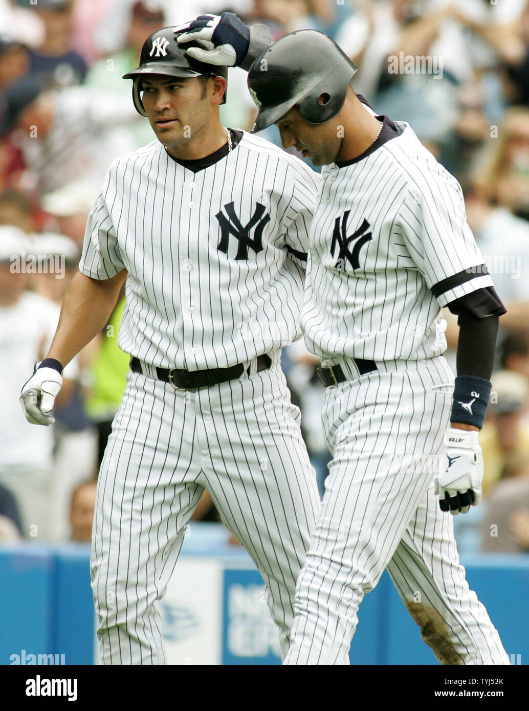 New York Yankees Johnny Damon (L) and Derek Jeter congratulate one ...