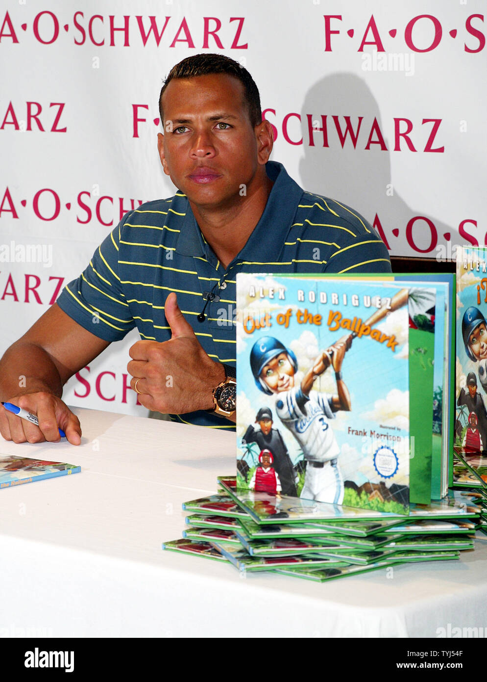 Alex Rodriguez poses for pictures before signing copies of his new ...