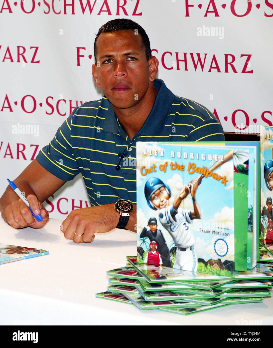 Alex Rodriguez poses for pictures before signing copies of his new ...