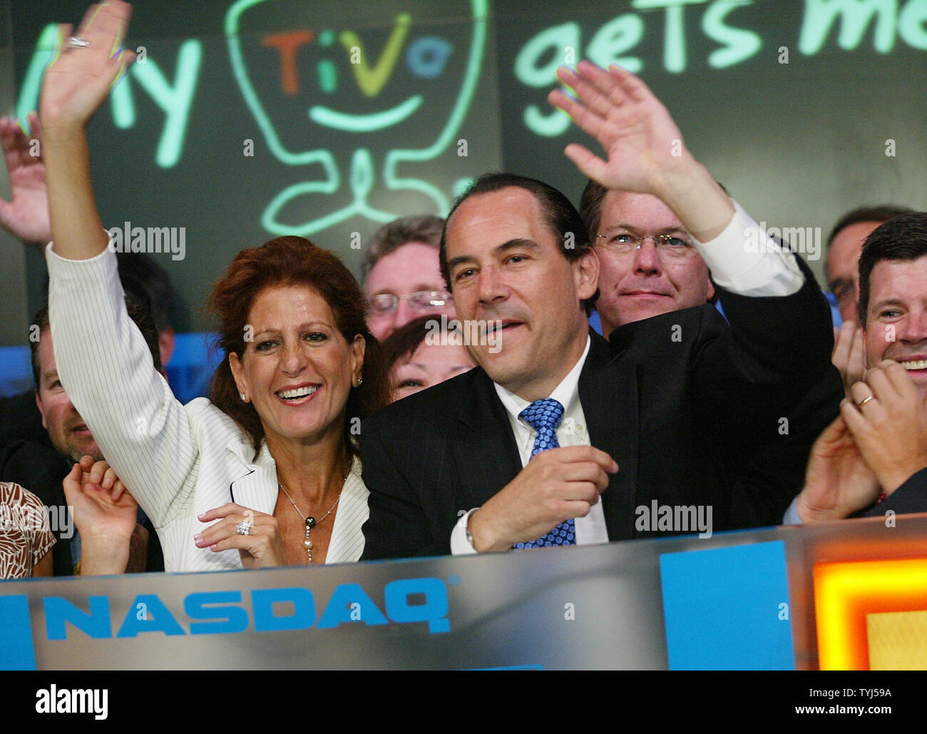 TiVo CEO Tom Rogers and wife Sylvia take part in the opening bell ...
