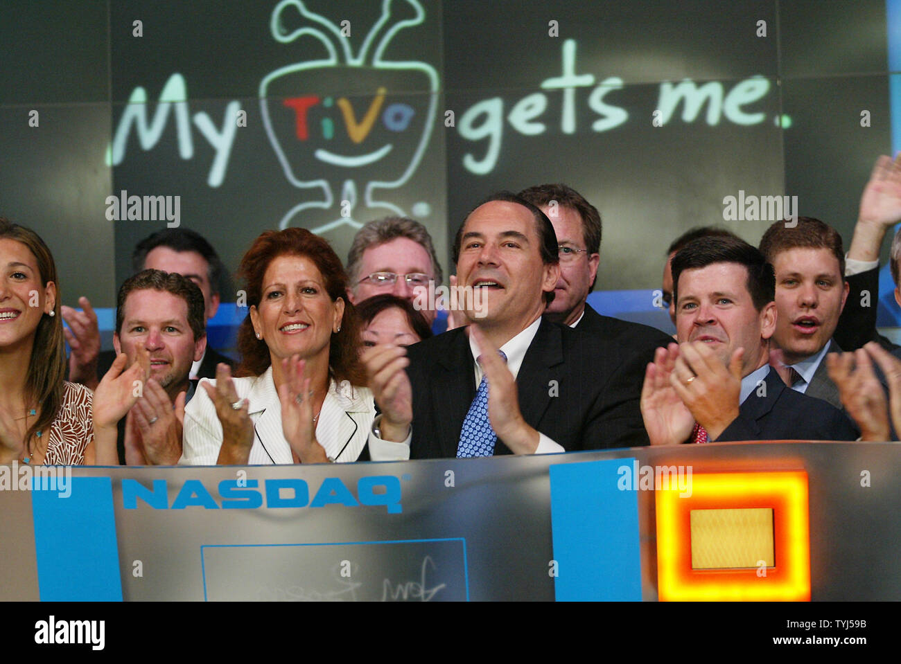 TiVo CEO Tom Rogers and wife Sylvia take part in the opening bell ...