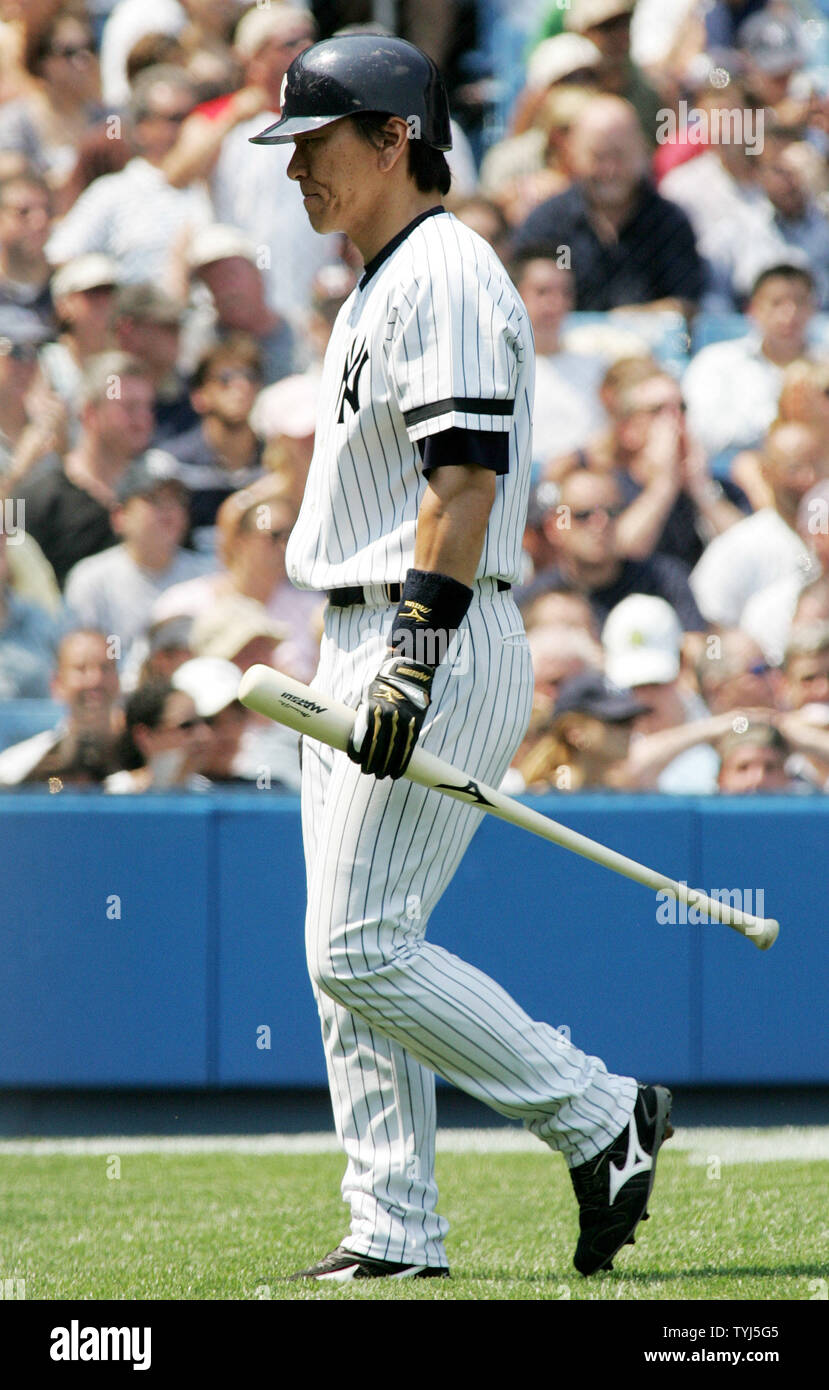New York Yankees Hideki Matsui walks back to the dugout after being ...