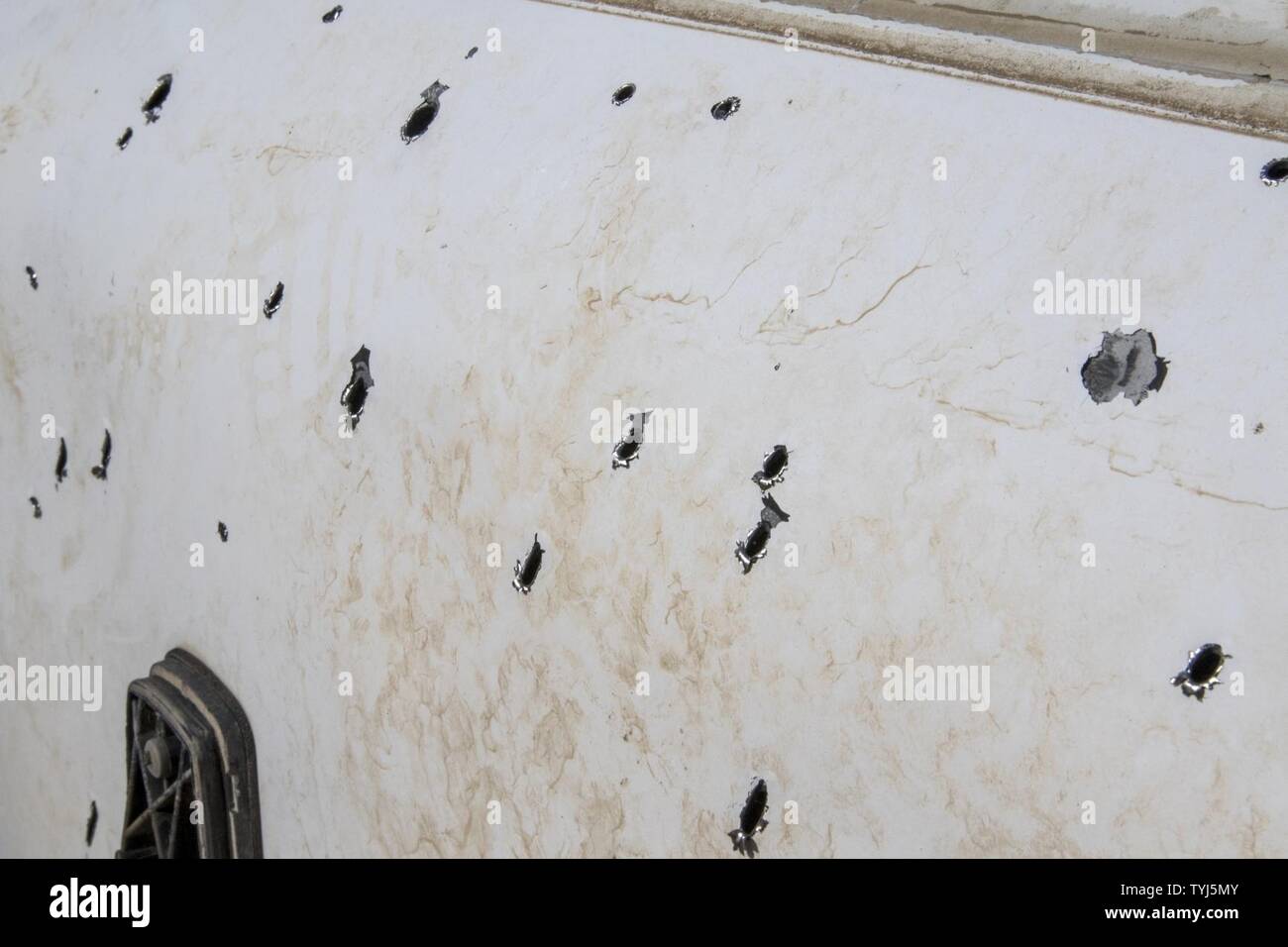 A truck peppered with holes from the tungsten steel pellets from the ...