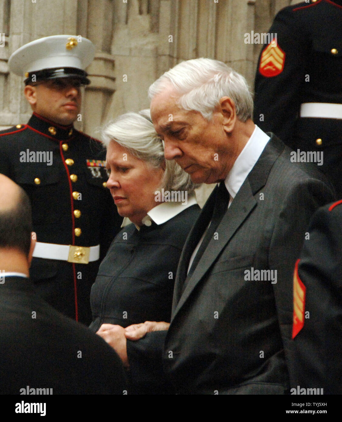 Anthony Marshall (R) and his wife Charlene leave funeral services at ...