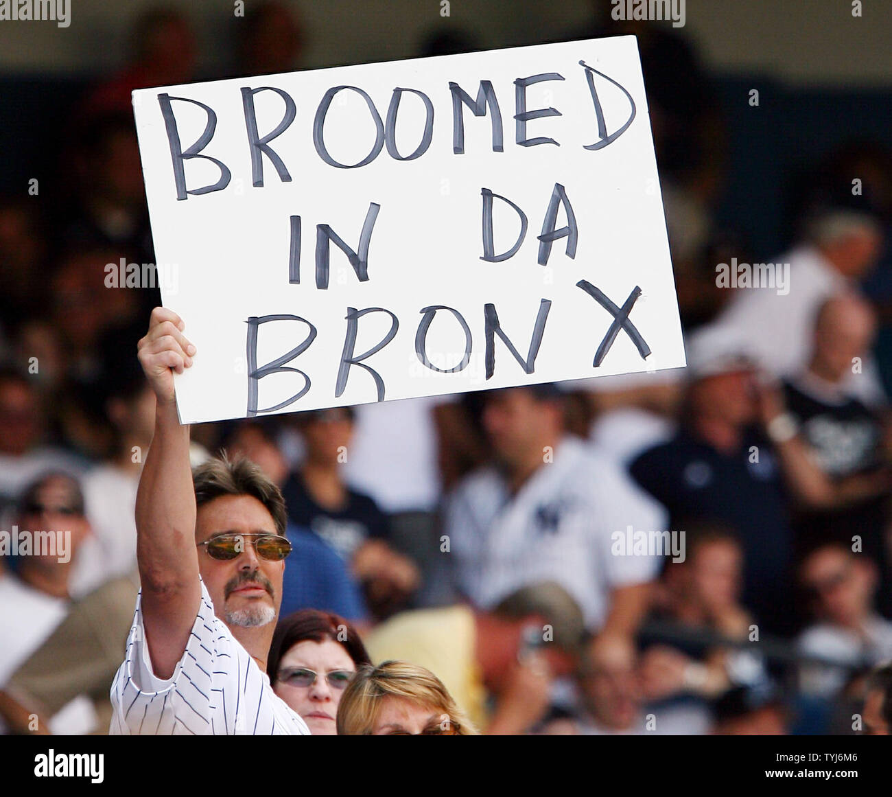 New York Yankees fans hold up signs at Yankee Stadium in New York City ...